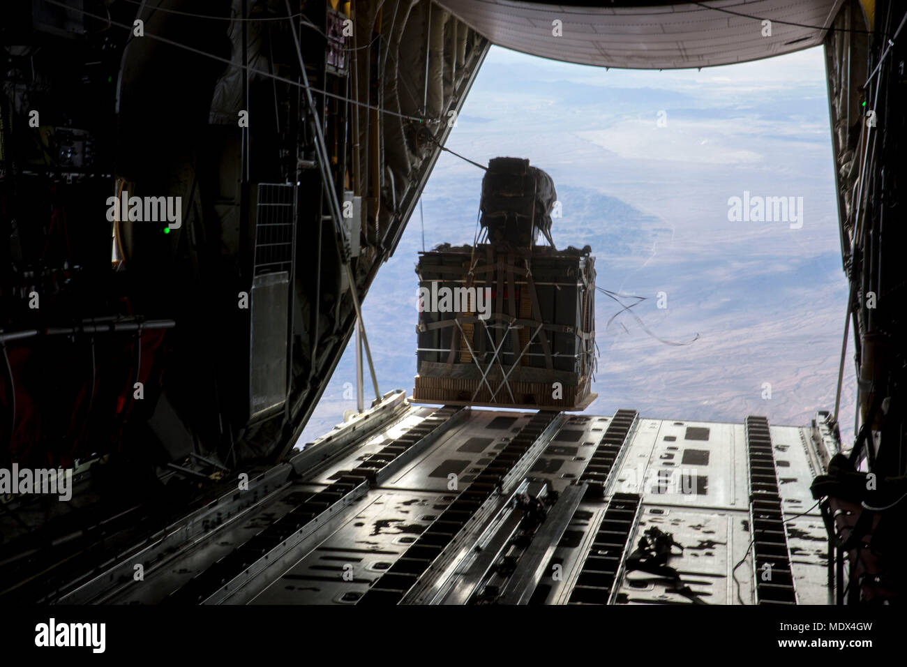 Cargo is released from a KC-130J Hercules with Marine Aerial Refueler ...