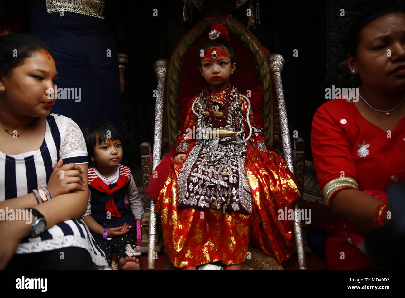 Lalitpur, Nepal. 20th Apr, 2018. Living Goddess Kumari observes the God ...