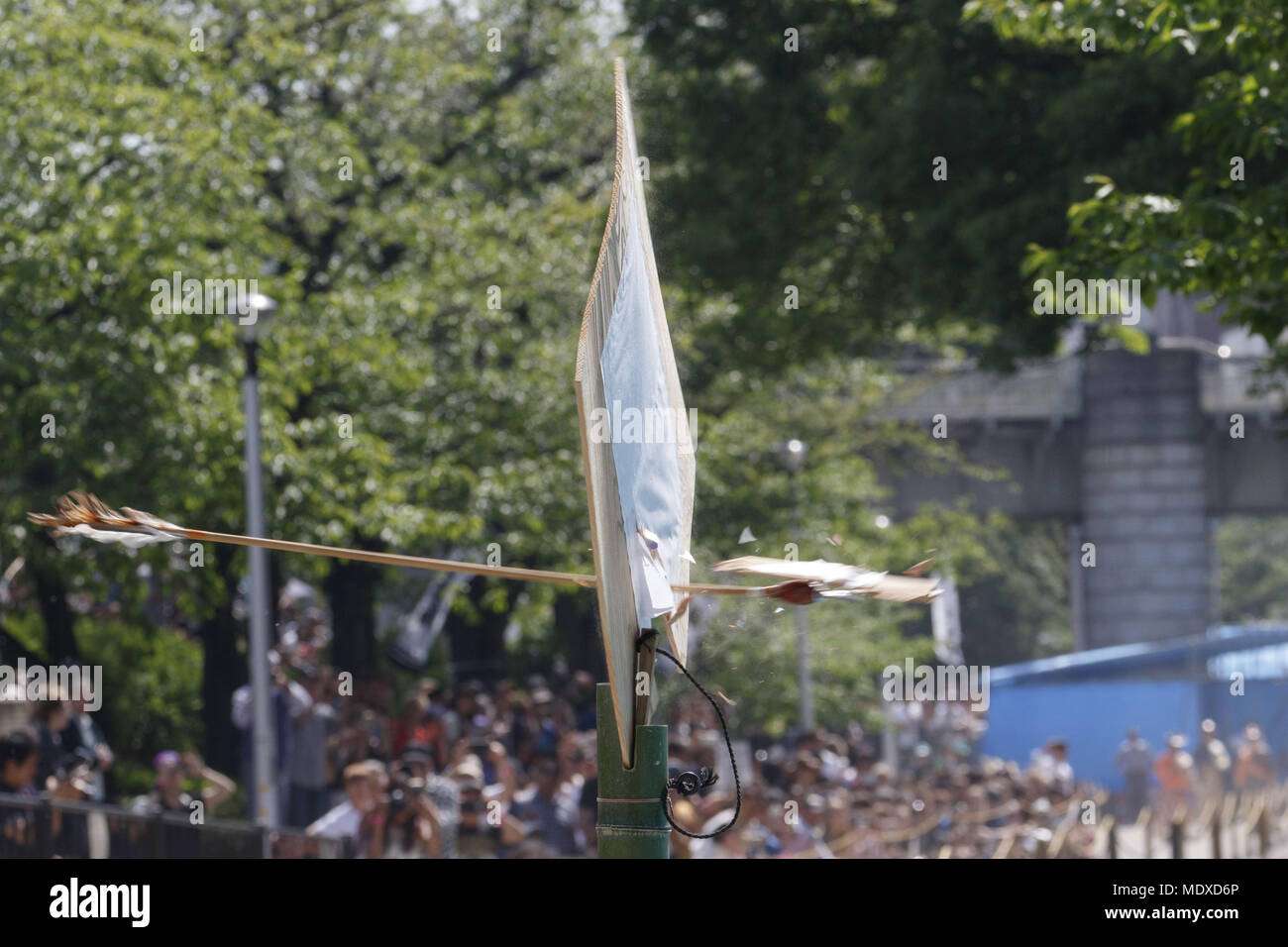Tokyo, Japan. 21st Apr, 2018. An arrow flying hits an archery target ...