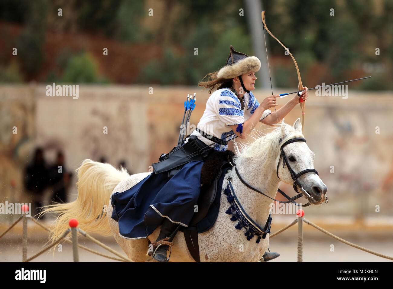 Amman, Jordan. 21st Apr, 2018. A competitor shoots during the 3rd ...