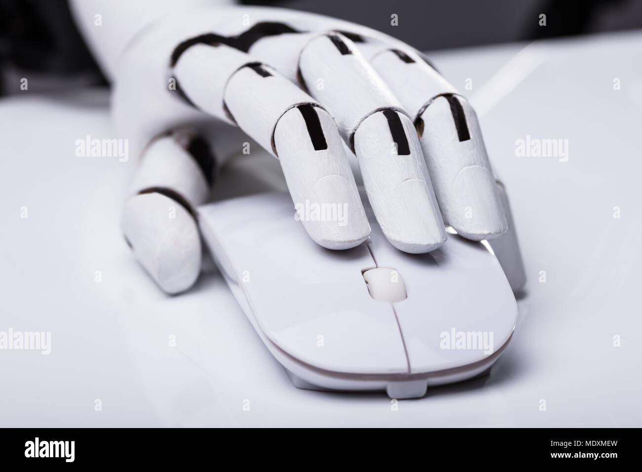 Close-up Of A Robotic Hand Using Computer Mouse Stock Photo - Alamy