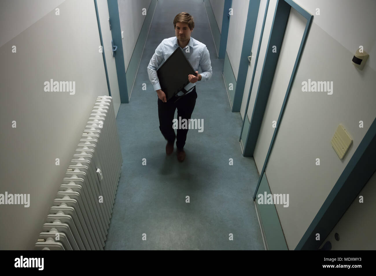 Professional man walking laptop computer hi-res stock photography and ...