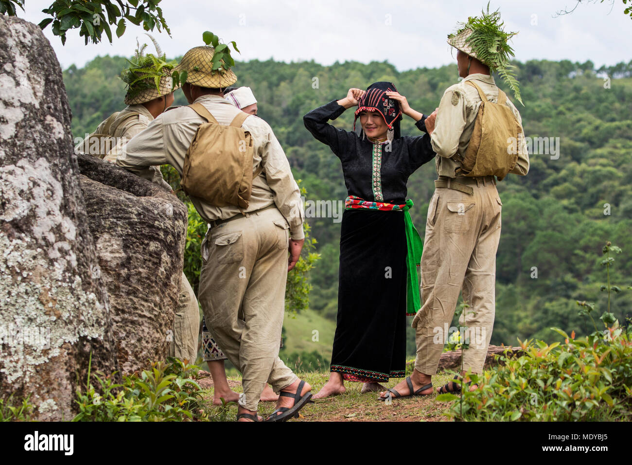 Actors dressed as Pathet Lao soldiers and women in traditional costume ...