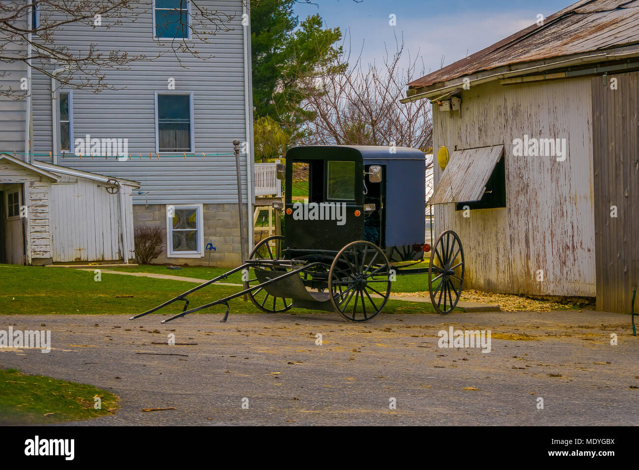 Amish buggy parked outside the barn Stock Photo - Alamy