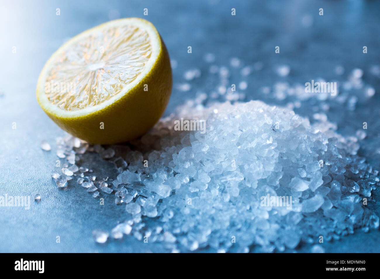 Lemon Sea Salt Crystals on Blue Surface. Organic Product Stock Photo ...