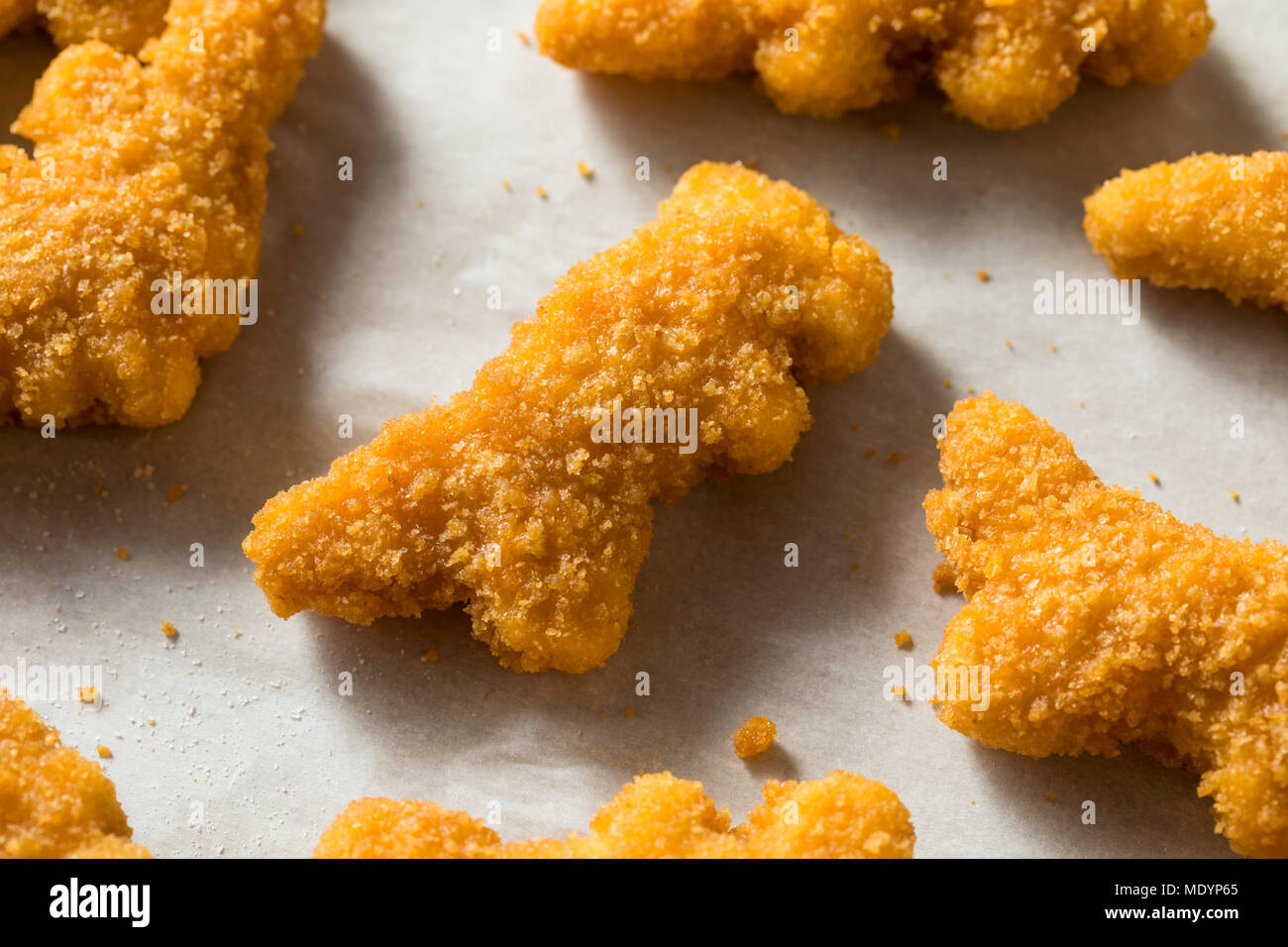 Kids Dinosaur Shaped Chicken Nuggets Ready to Eat Stock Photo - Alamy