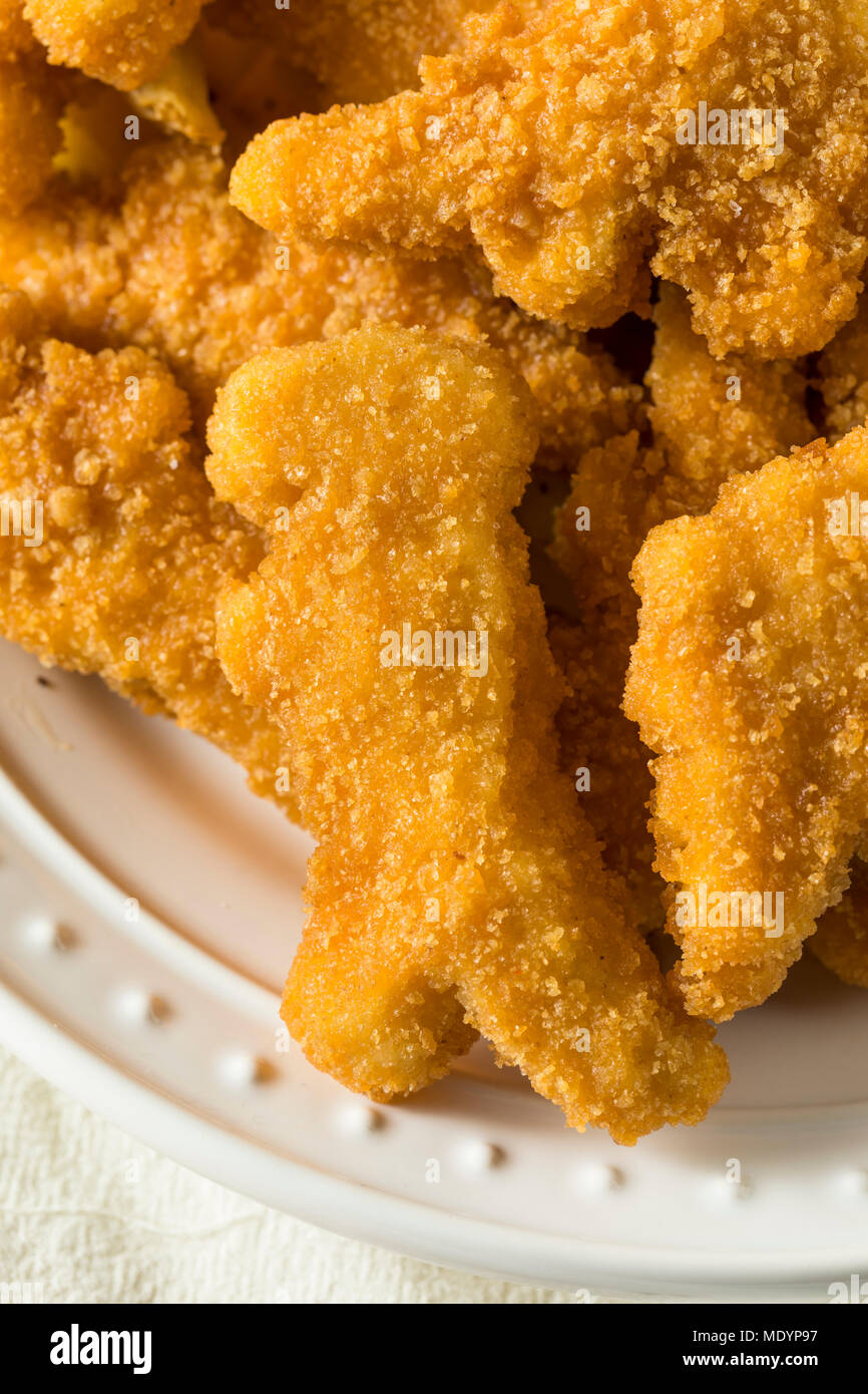 Kids Dinosaur Shaped Chicken Nuggets Ready to Eat Stock Photo - Alamy