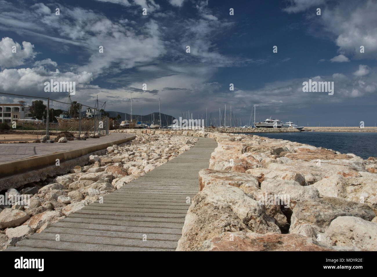 Boardwalk, rocks and blue sky with clouds, Polis, Cyprus Stock Photo ...