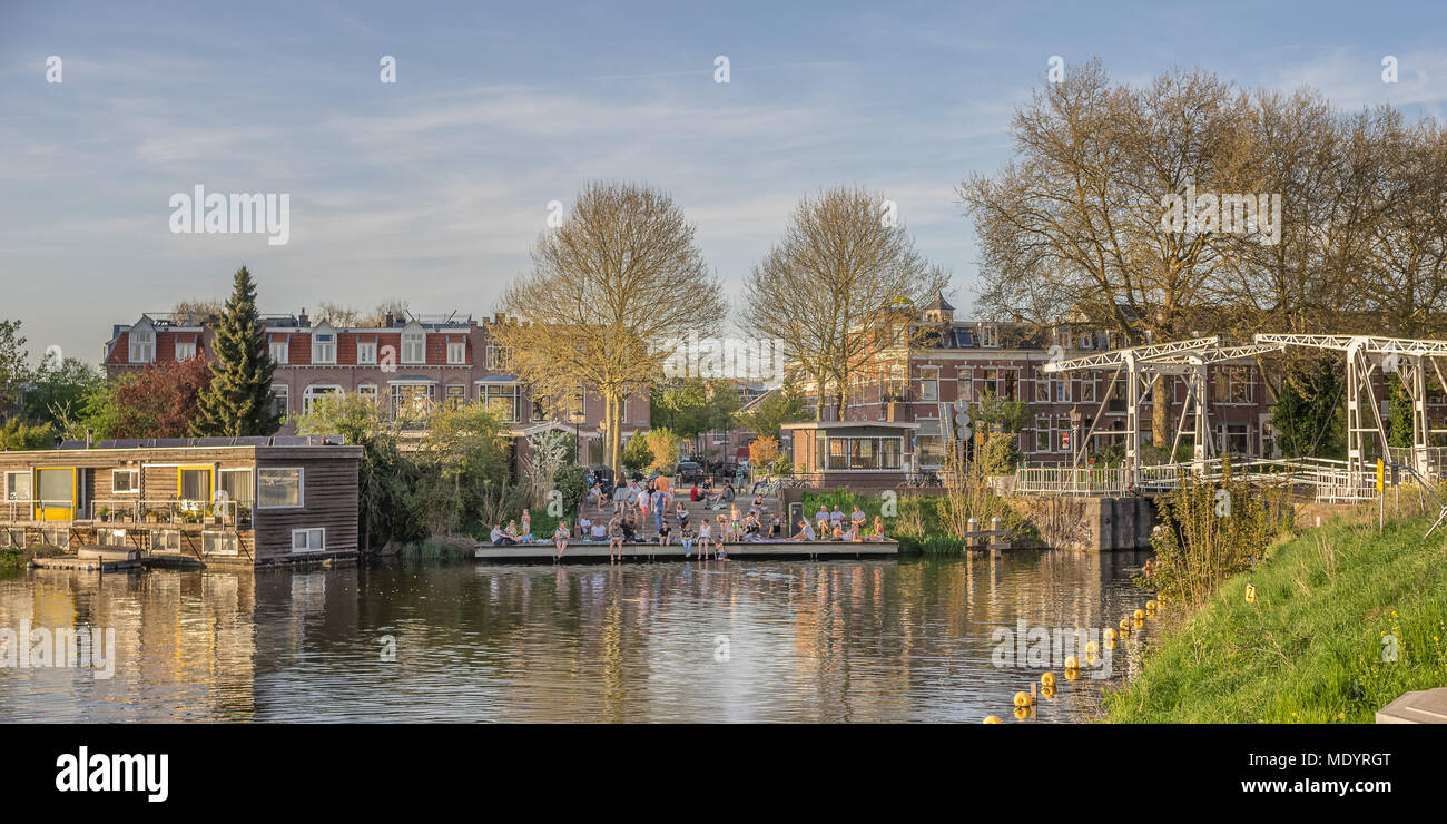 People enjoying the first warm spring days near the water in Lombok ...
