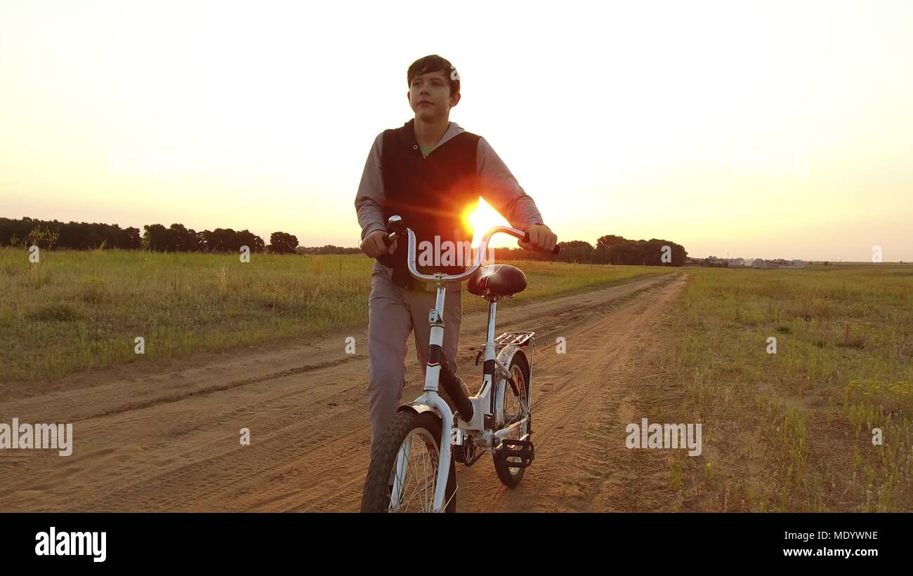 Boy teenager riding bicycle. the Boy teenager riding bicycle goes to ...