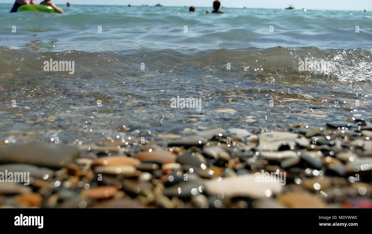 Sea beach pebbles wave. Ocean water abstract background Stock Photo - Alamy