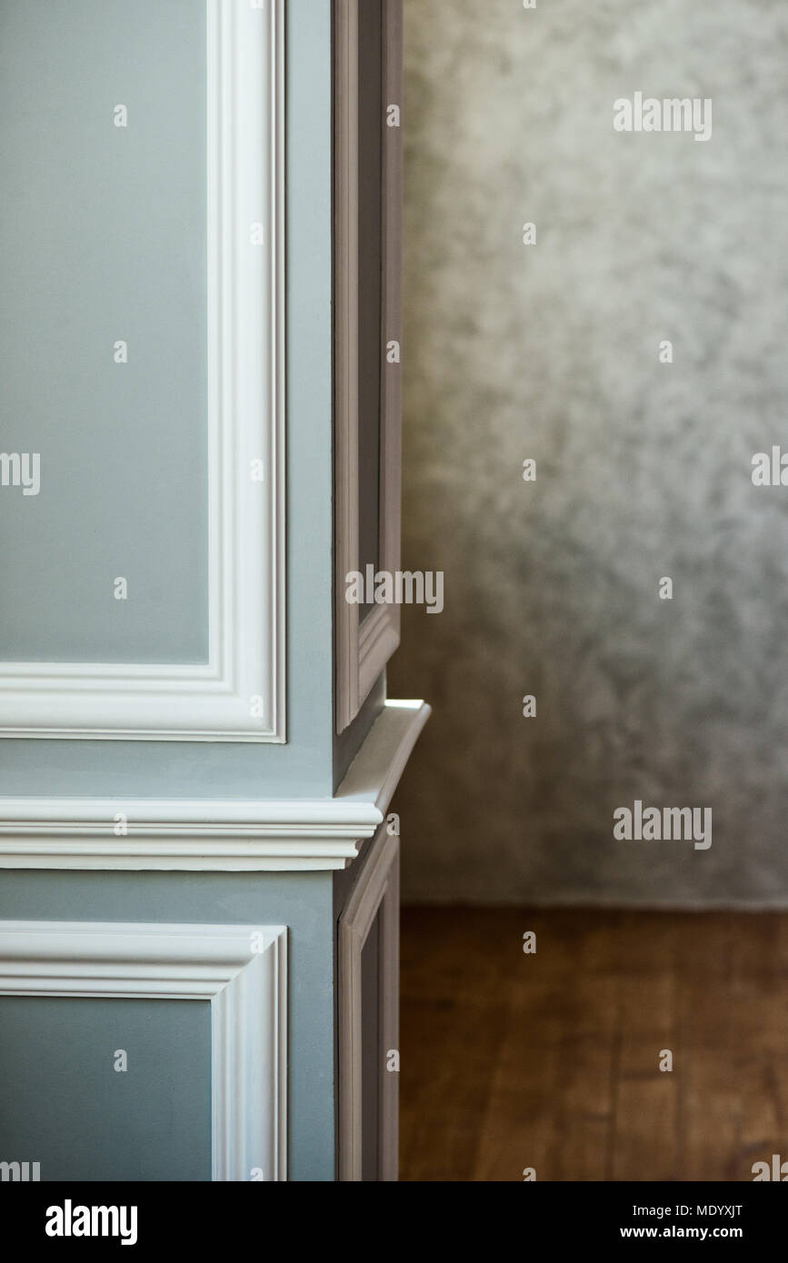 Gray column with white molding. Texturized grey putty. Vintage or ...