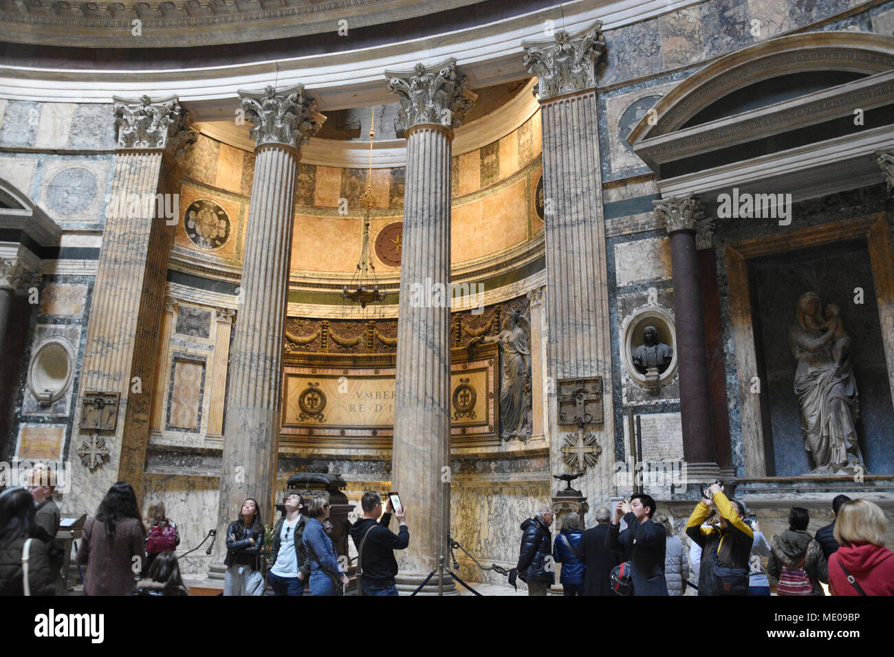 Tourists taking photos inside the Pantheon. The Pantheon is a former ...