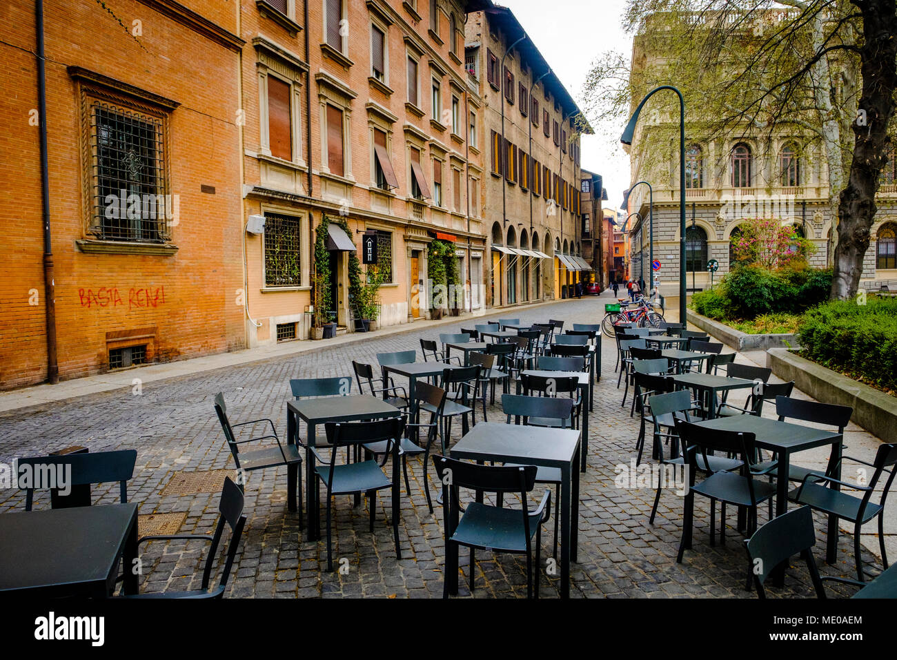 Early morning and empty tables and chairs in the Piazza Minghetti ...