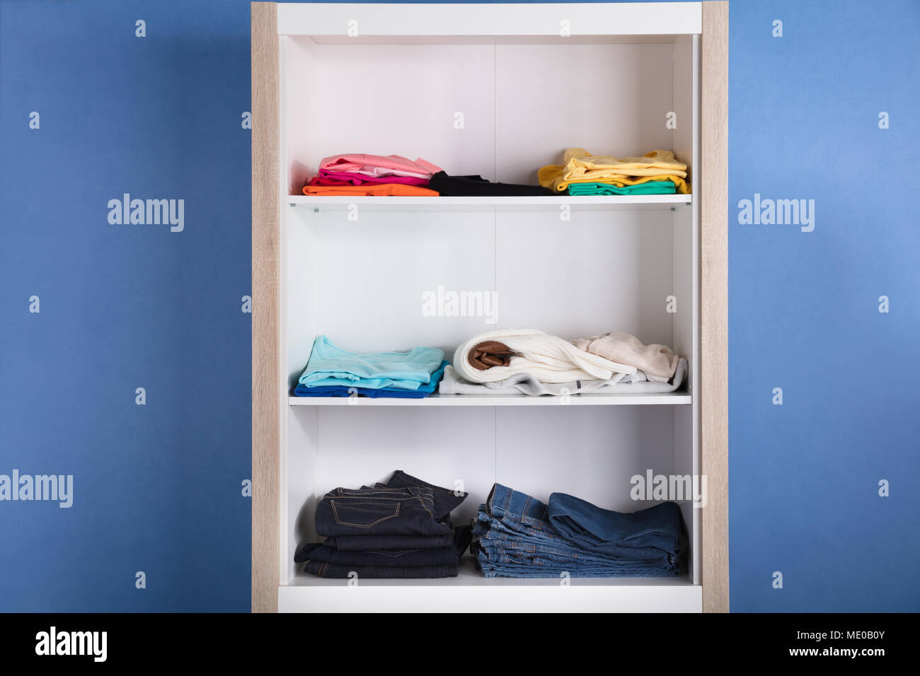 Open wardrobe folded clothes hi-res stock photography and images - Alamy