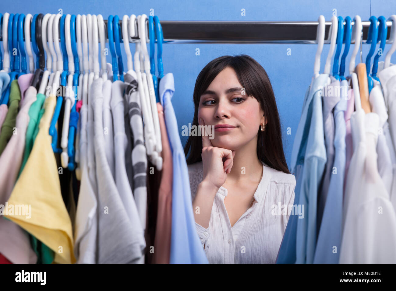 Woman looking inside wardrobe hi-res stock photography and images - Alamy