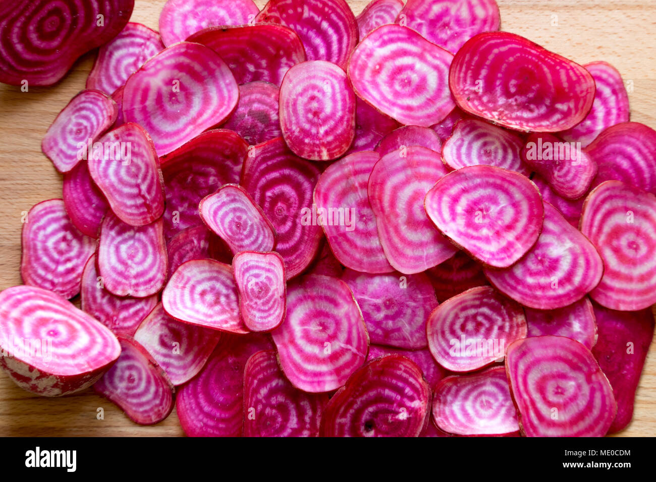 Colourful root vegetables slices. Sliced organic chioggia beets (candy ...