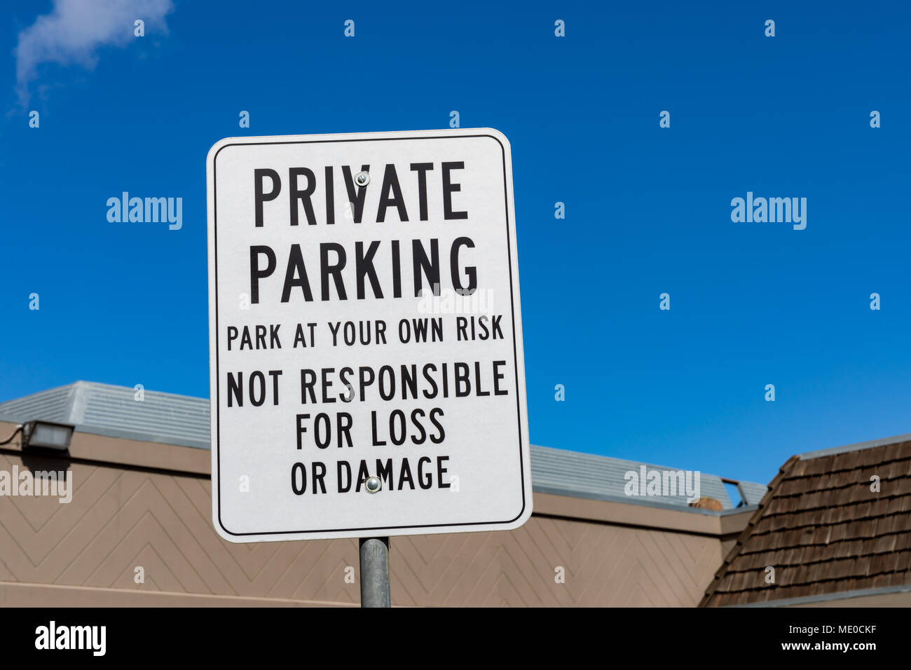"Private parking – Park at your own risk – Not responsible for loss or ...