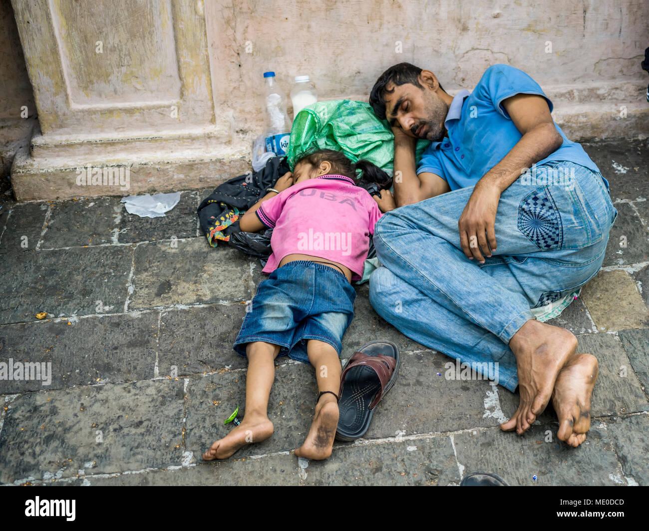 Homeless child sleeping on street hi-res stock photography and images ...