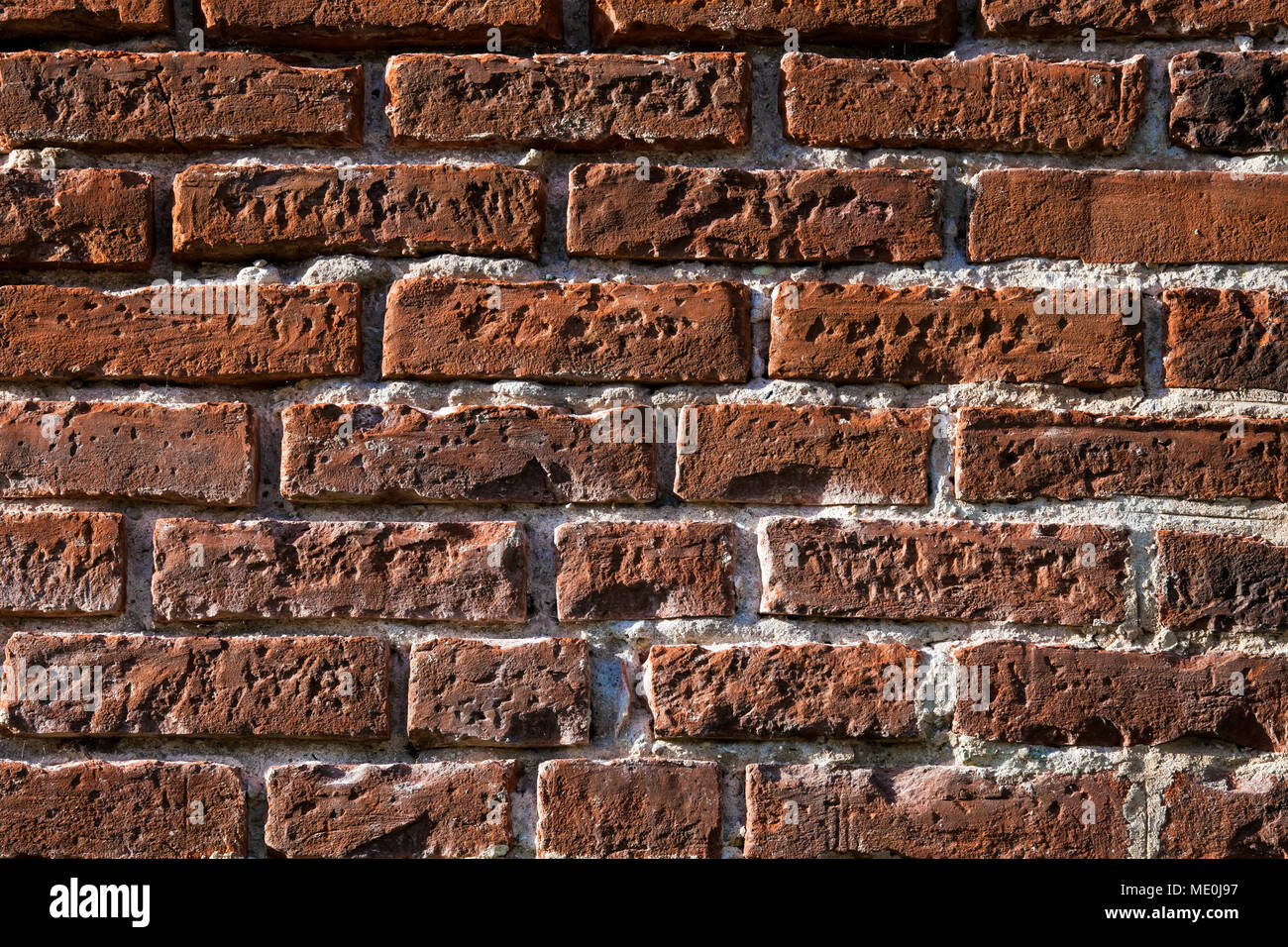 Cracked red brick wall, blocks in a line background Stock Photo - Alamy