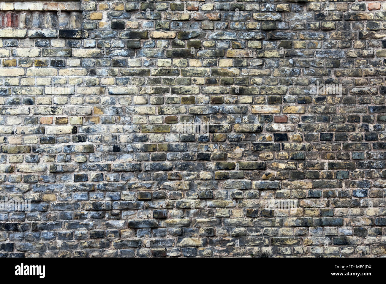 Cracked gray brick wall, blocks in a line background Stock Photo - Alamy