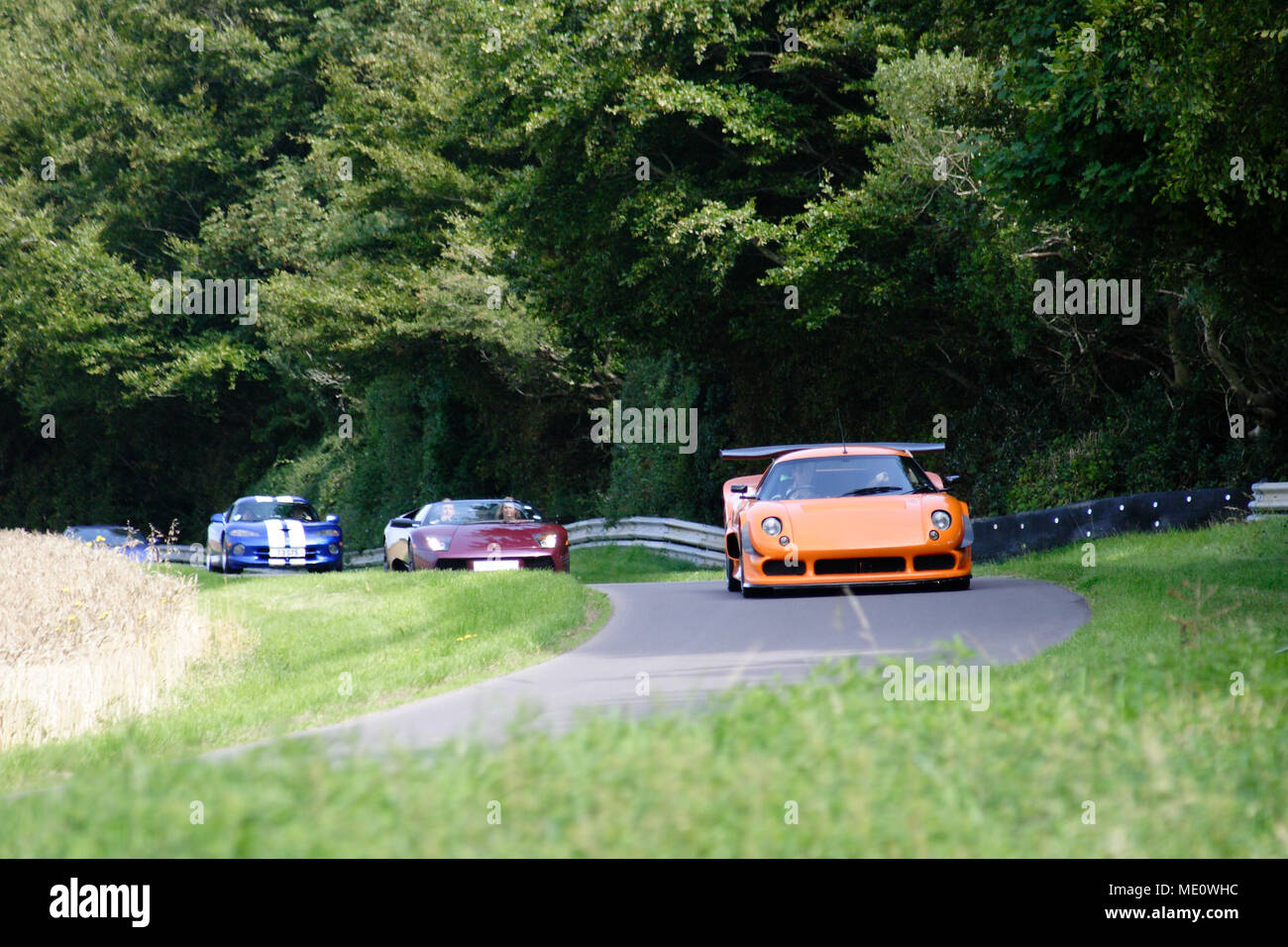 Orange Noble M12 GT0-3R British supercar sports car driving and leading ...