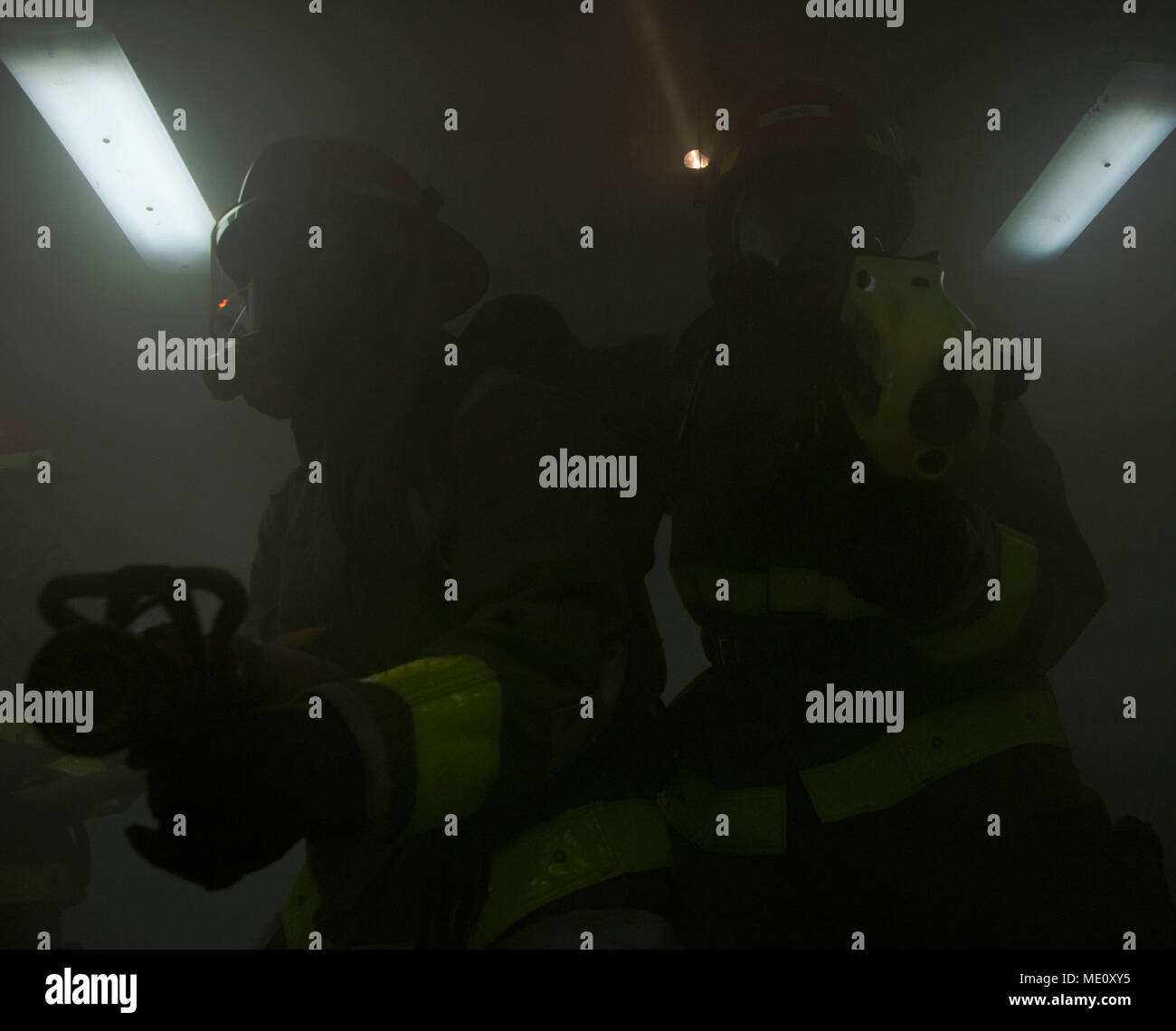 Fire tender checking hi-res stock photography and images - Alamy