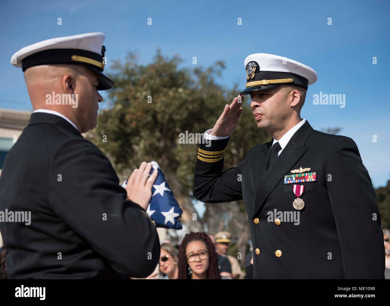 171208-N-UG095-113 SAN DIEGO (Dec. 8, 2017) Lt. Carl Bayes presents the ...