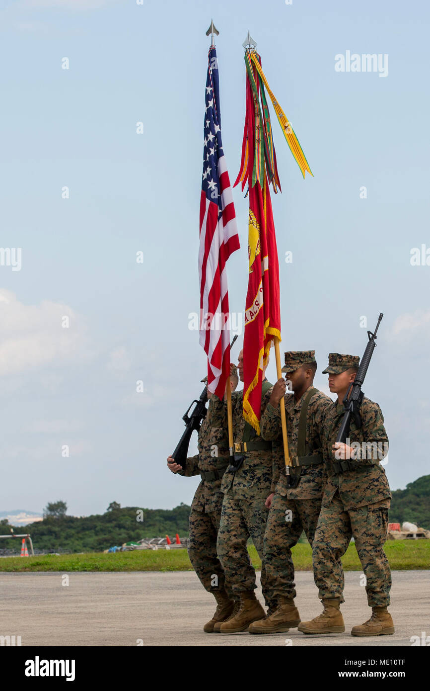 U.S. Marines with the color guard march the colors during a relief and ...