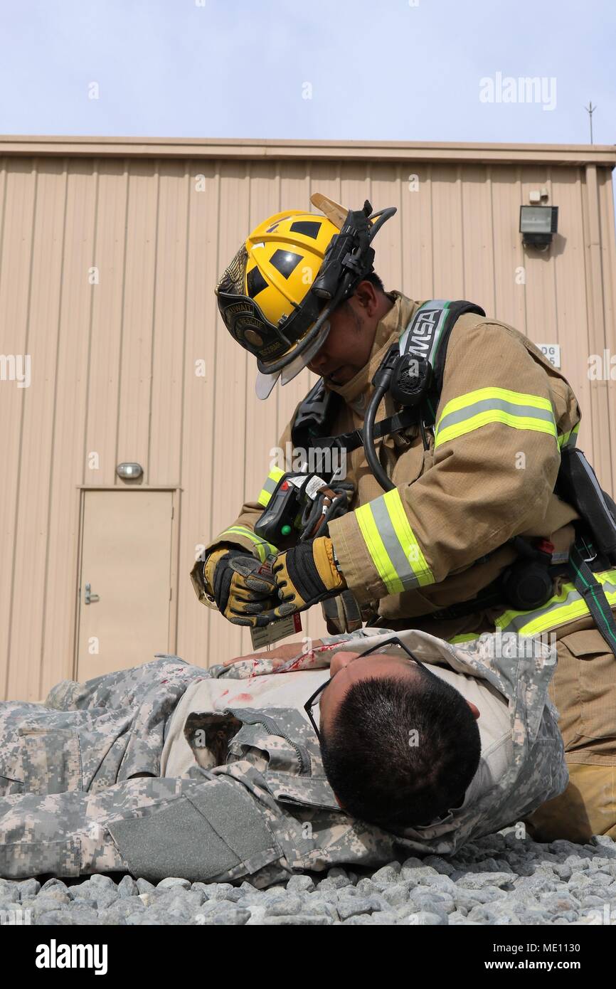 171205-A-RW053-015 Fire Fighter performs lifesaving procedures on ...