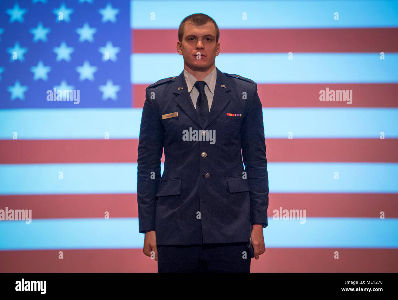 U.S. Air Force 2nd Lt. Eric Baldwin stands at attention after being ...