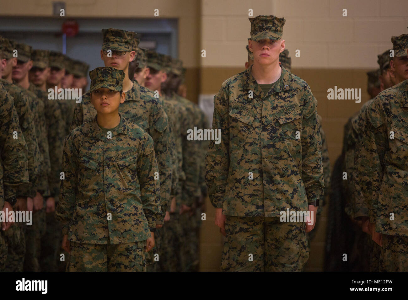 Pfc. Yolanda Vigil, left, stands in formation during her graduation ...