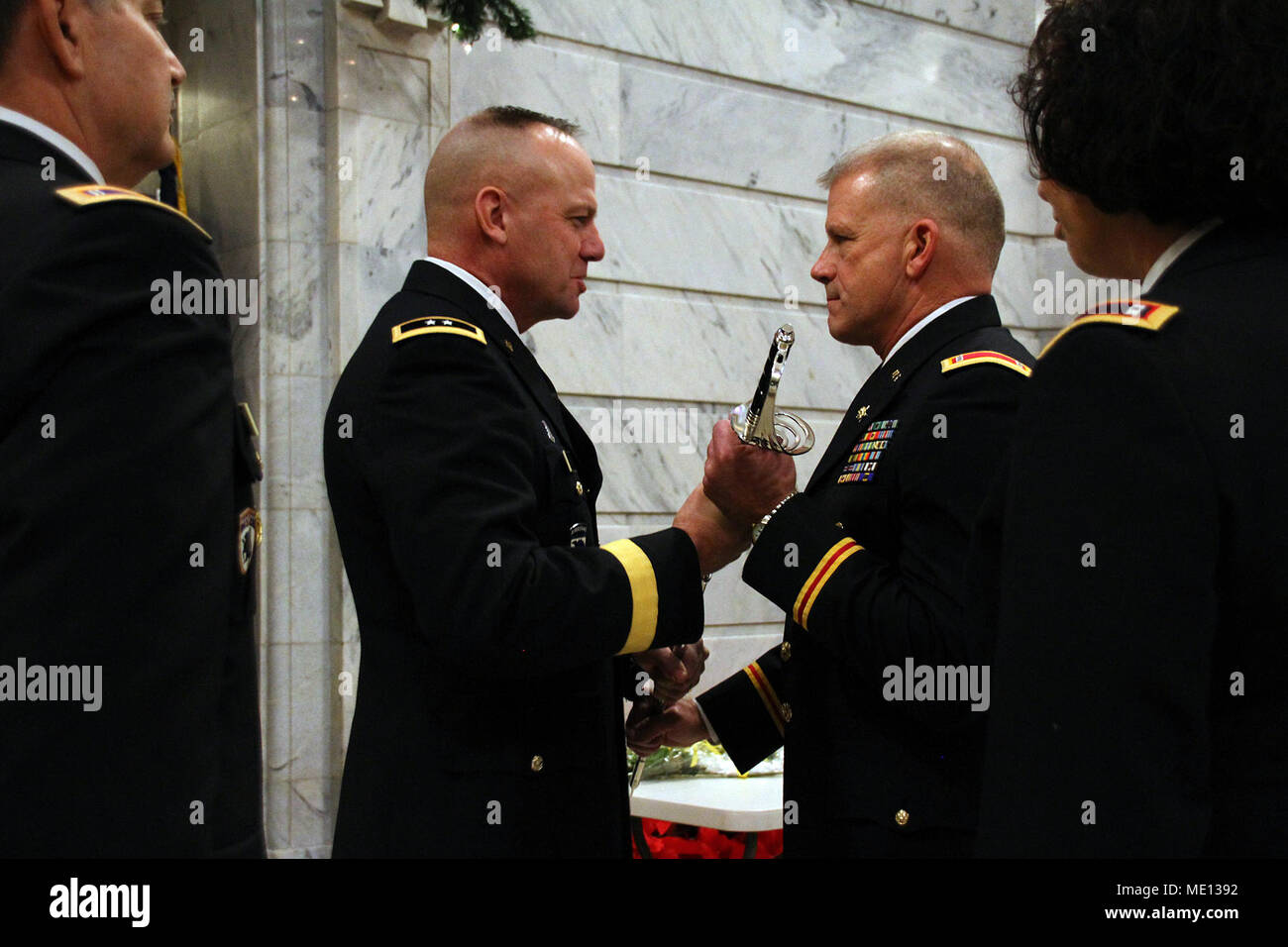 Maj. Gen. Stephen Hogan passes the warrant officer saber to Chief ...