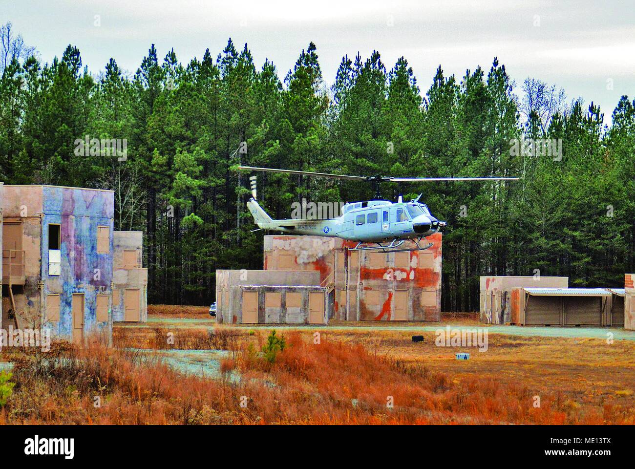 A utility helicopter lands in the middle of the Urban Training Center ...