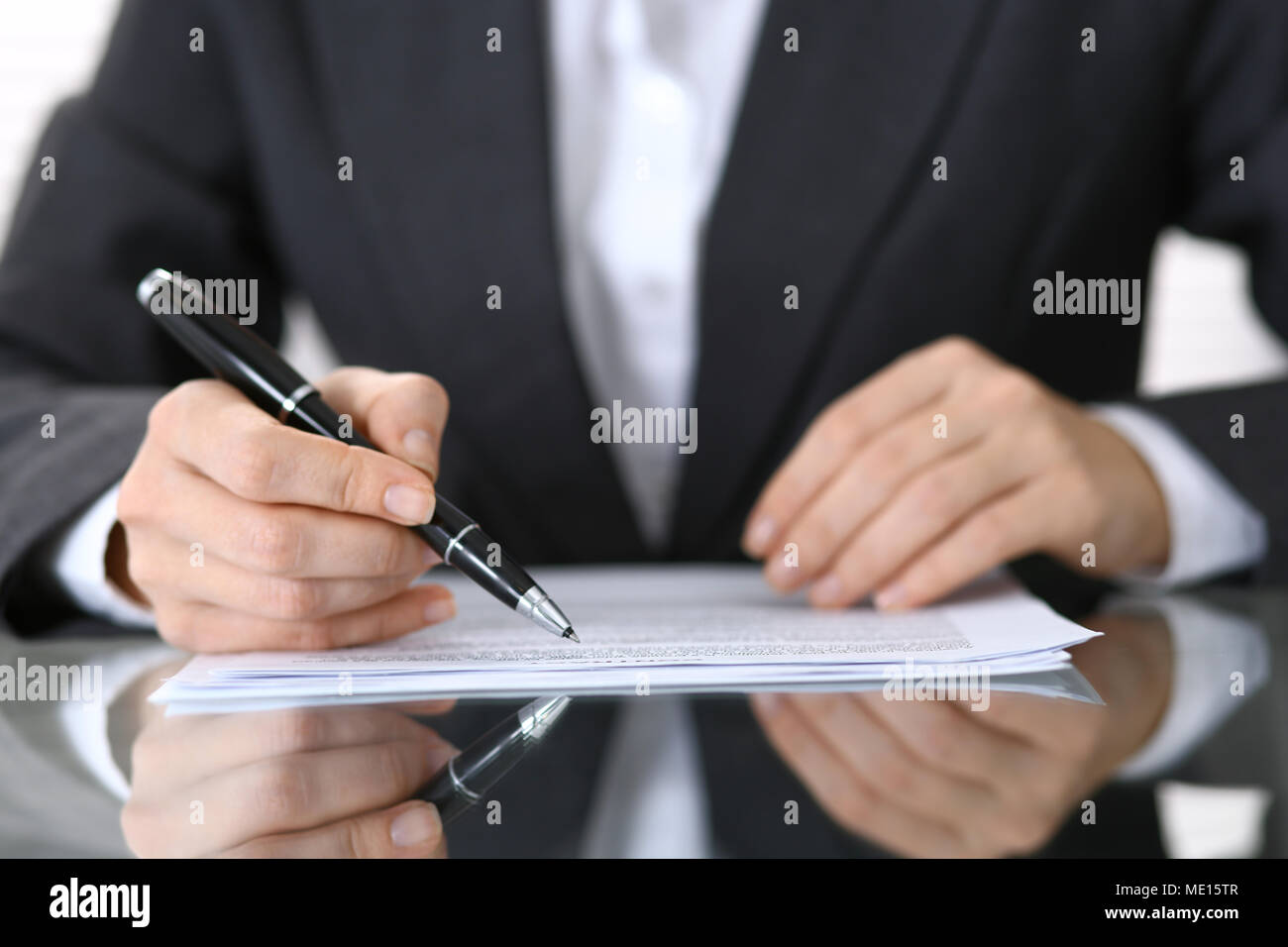Close-up of female hands with pen over document, business concept Stock ...