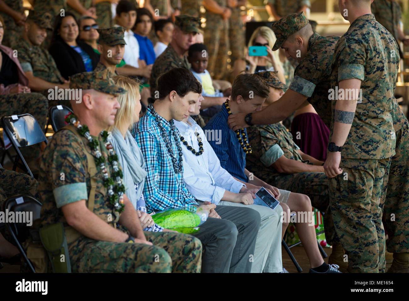 Marines with 1st Battalion, 3rd Marine Regiment deliver flowers and lei ...