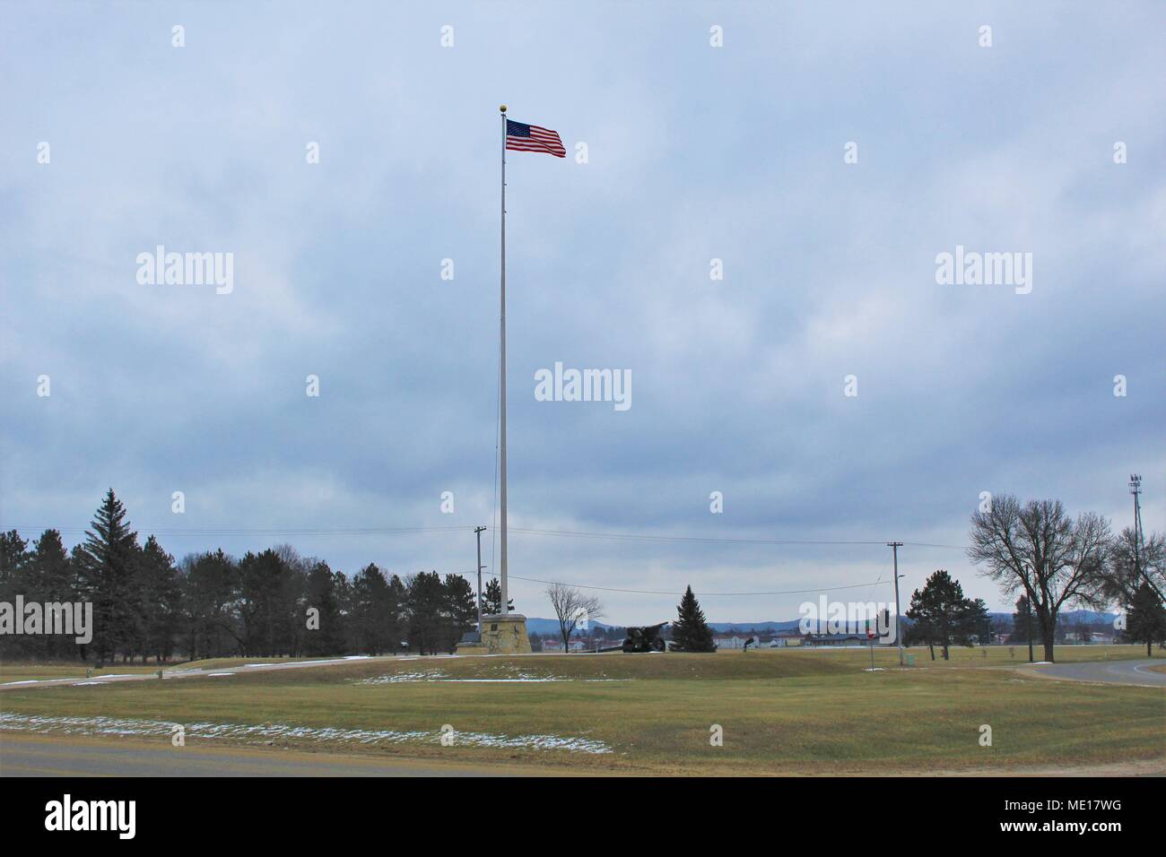 The flag of the United States of America is brightened by a backdrop of ...