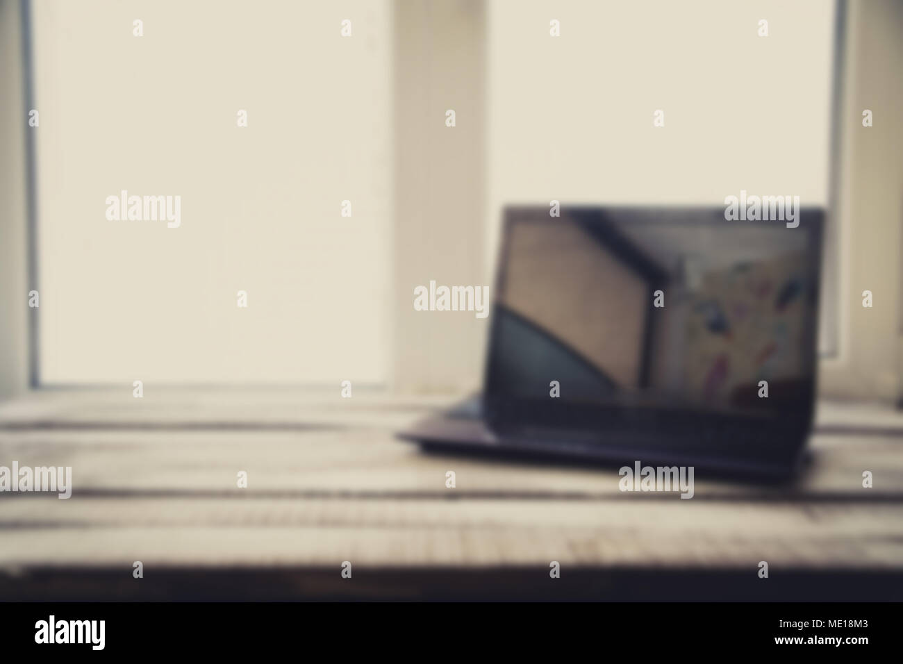 Laptop on the wood table Stock Photo - Alamy