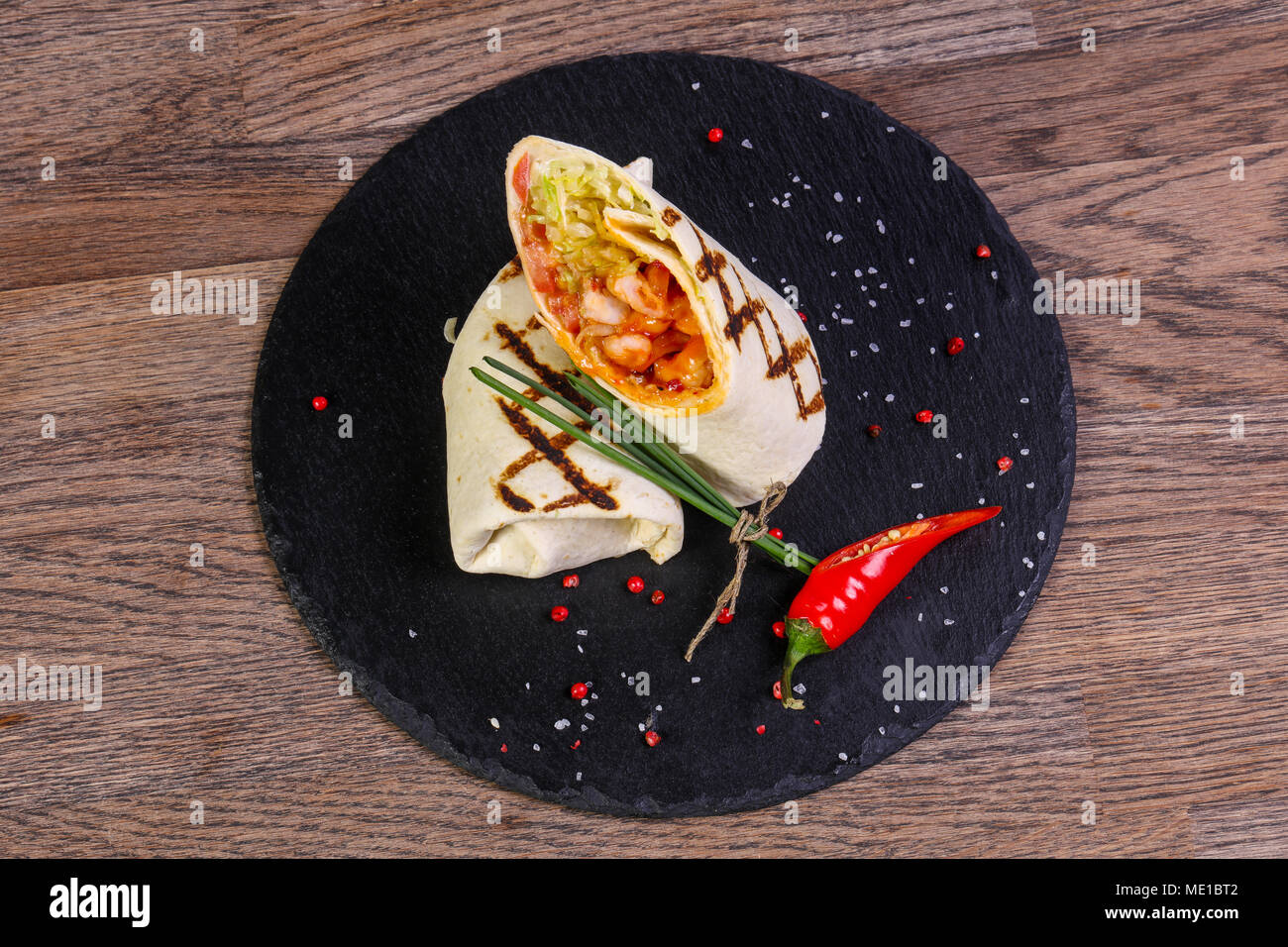 Chicken roll with tortilla served pepper Stock Photo - Alamy