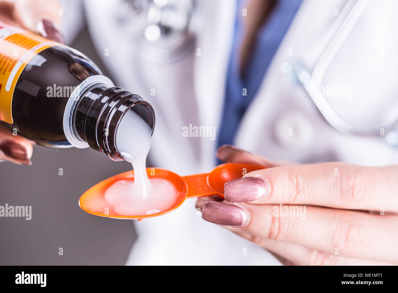 Cough syrup pouring spoon hi-res stock photography and images - Alamy
