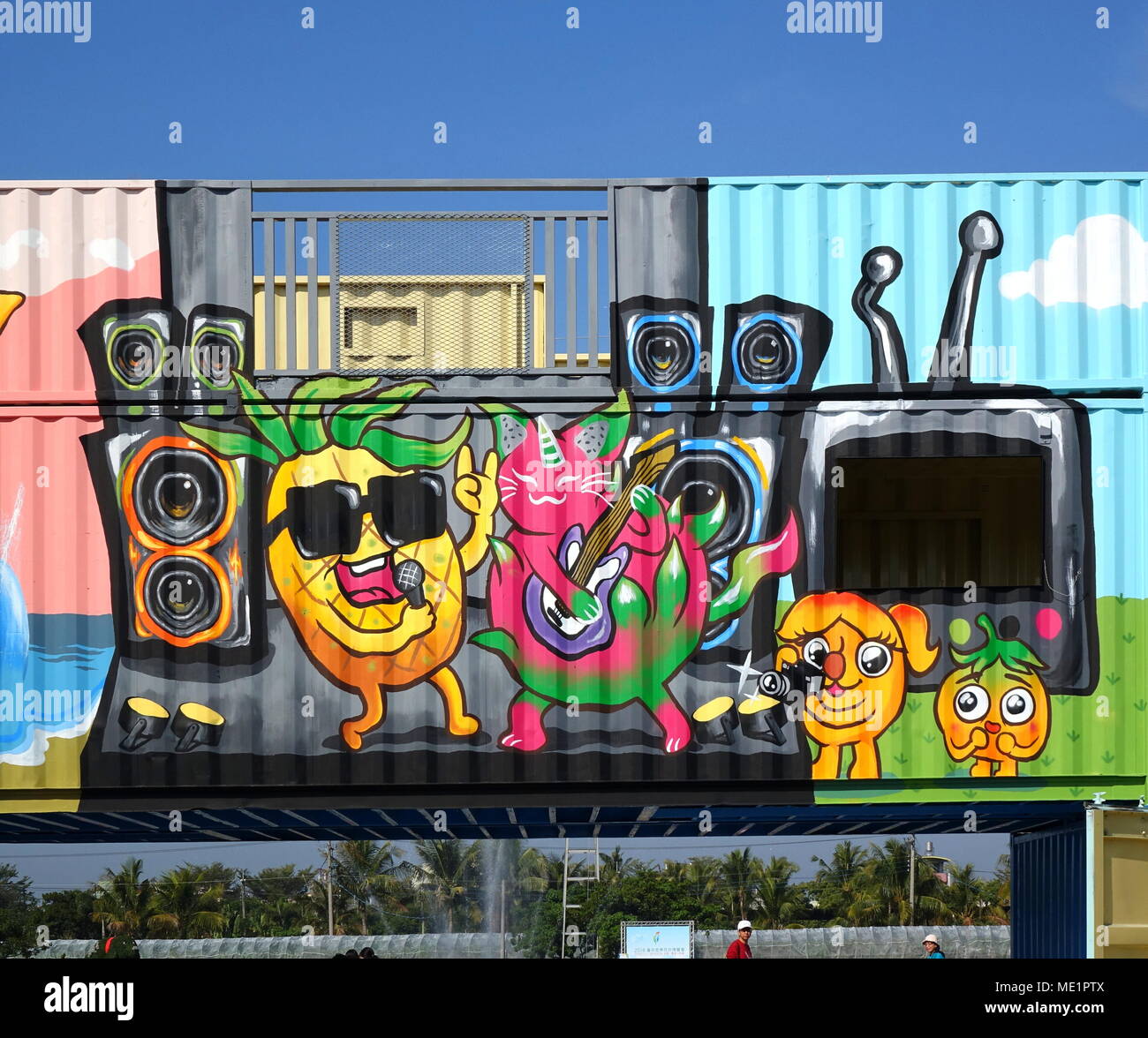 PINGTUNG, TAIWAN -- FEBRUARY 14, 2018: Shipping containers painted with ...