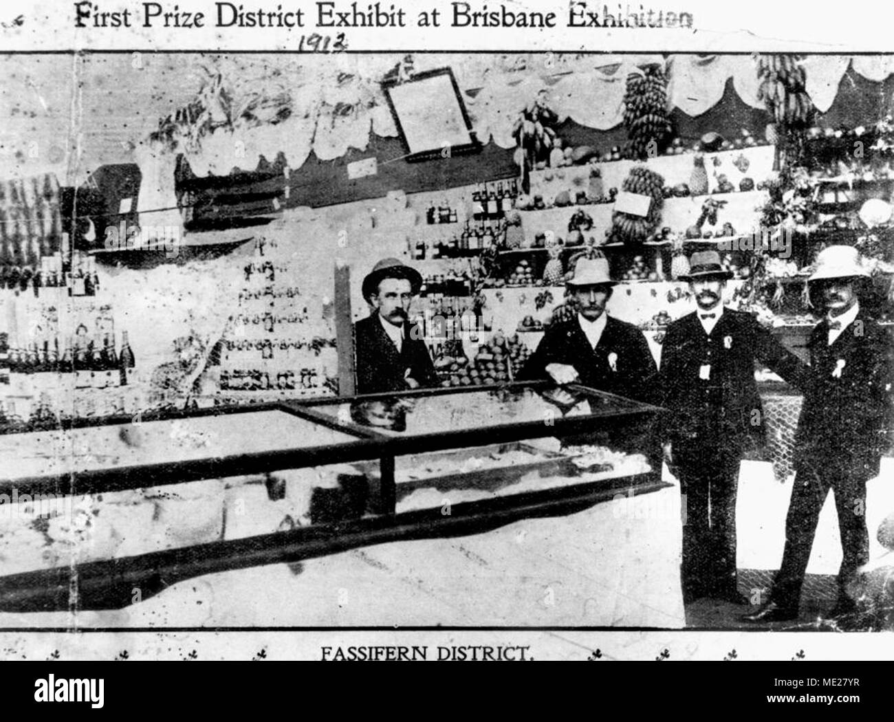 Four gentlemen inspect the Fassifern District Exhibit which won first ...
