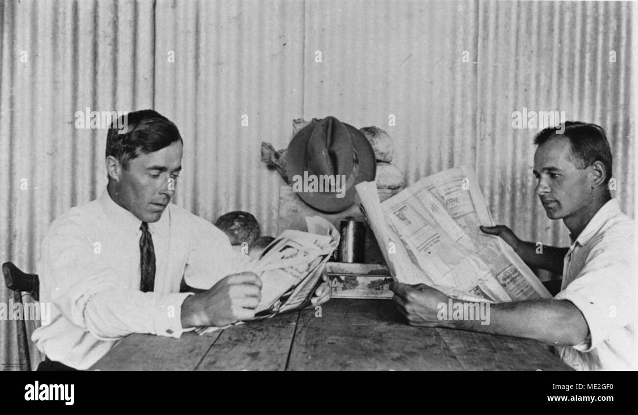 Cane farmers reading newspapers, Tully, ca 1929 Stock Photo - Alamy