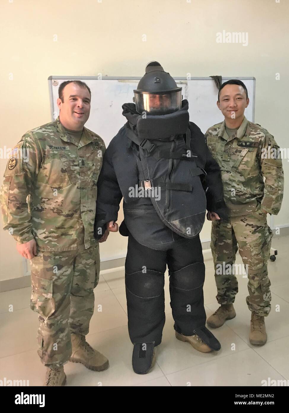 1st Sgt. Cole Schwartz, left, and Maj. Samuel McDowell look on as Sgt ...