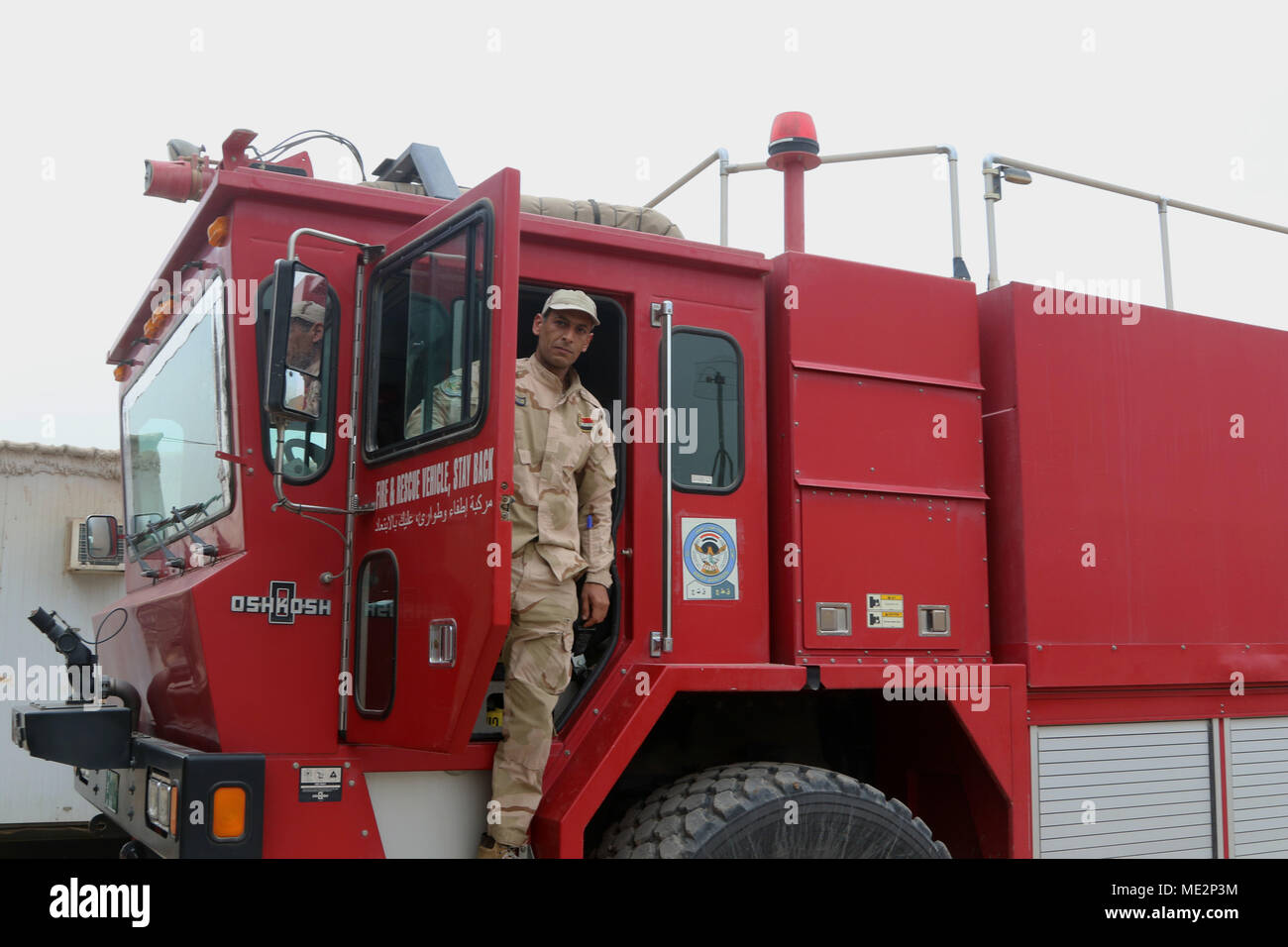 A fireman assigned to the Iraq Army Aviation drives his fire truck to ...
