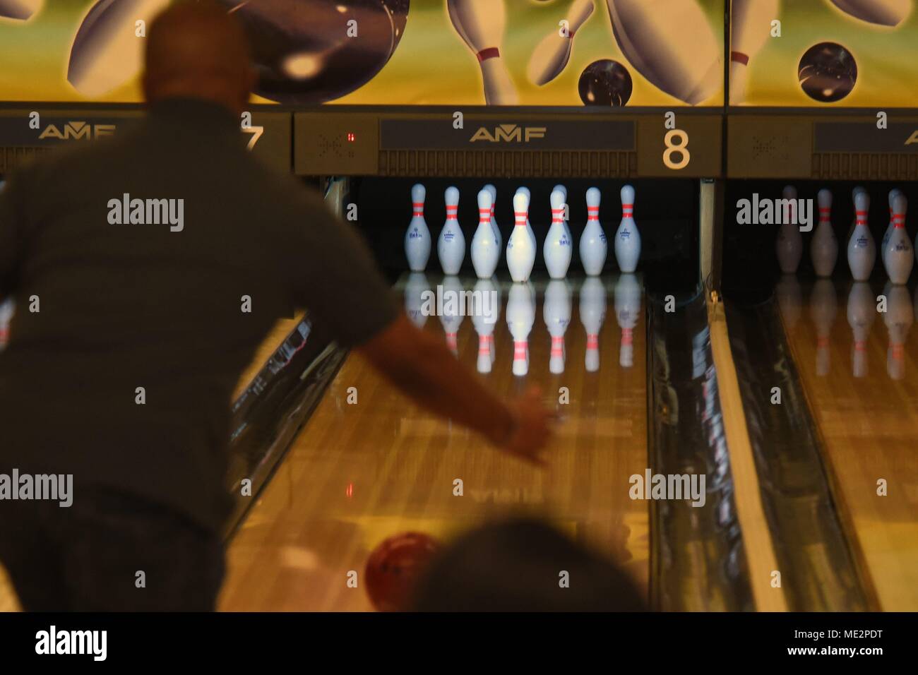 SCHRIEVER AIR FORCE BASE, Colo.-- -- An Airman rolls a bowling ball ...
