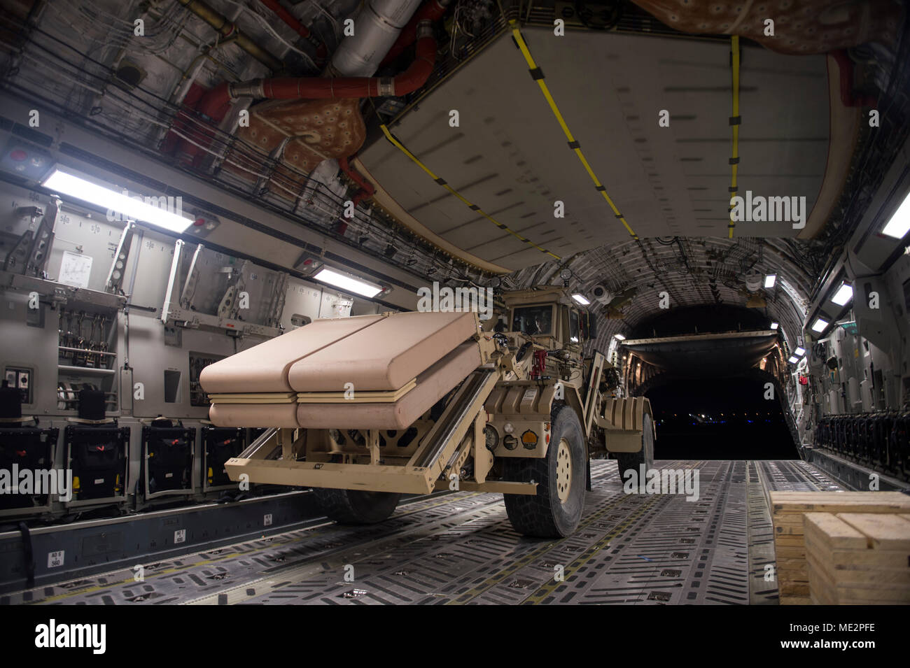 A Husky vehicle mounted mine detector Mk III is loaded onto a C-17 ...