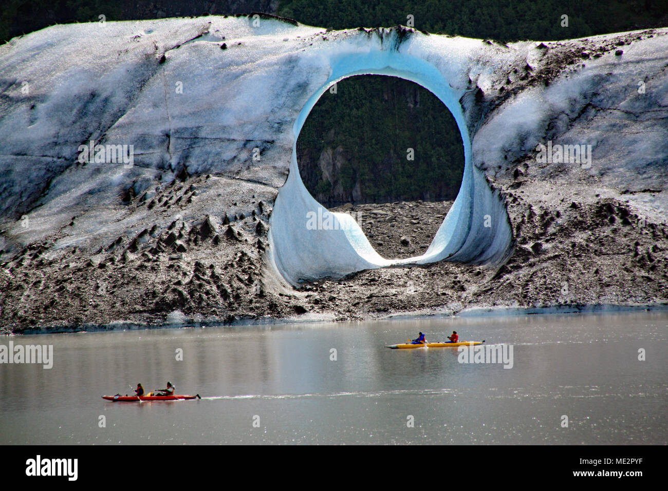 Kayak tour below a blue melting Alaskan glacier in Valdez Alaska Stock ...