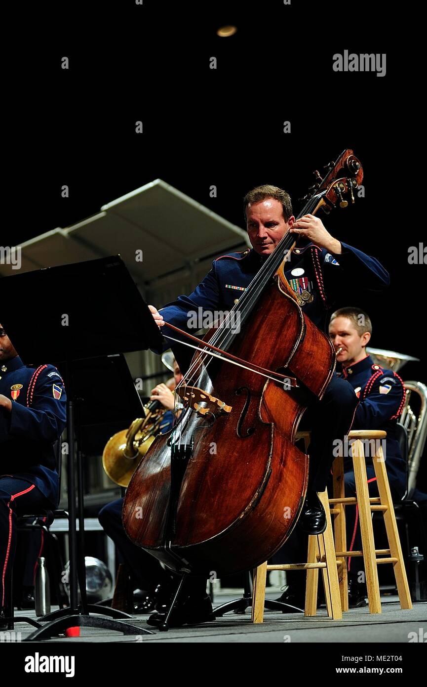 Senior Chief Mark McCormick, of the Coast Guard Band, plays the base ...