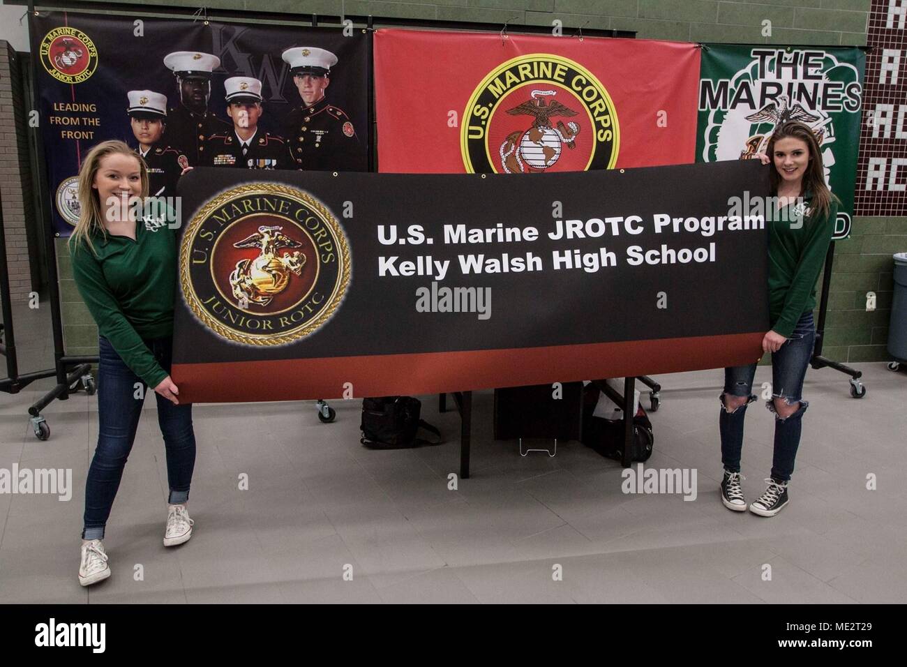 Students with Kelly Walsh High School hold up a Marine Corps JROTC ...